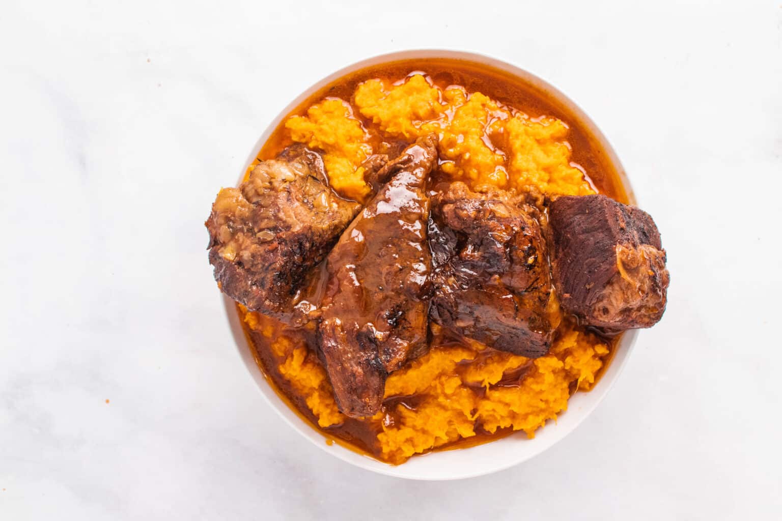 Braised Short Ribs Over Sweet Potato Puree - Girl Carnivore